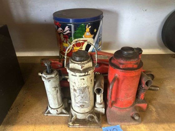Three bottle jacks, a 2-ton floor jack and an empty tin in Harvey, ND, USA