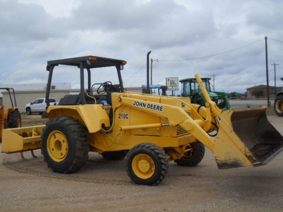 John Deere 210C: Prices, Specs, and Trends