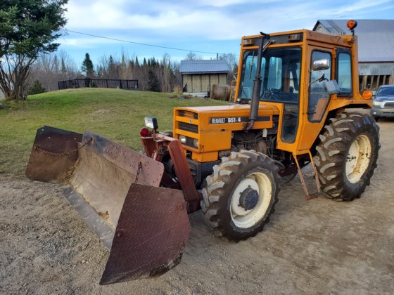 Renault 651-4S farm tractor with cab and plow in Quebec, Canada