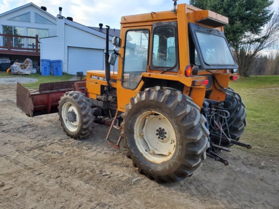 Renault 651-4S farm tractor with cab and plow in Quebec, Canada