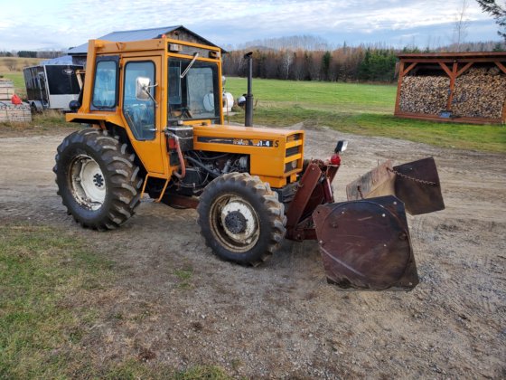Renault 651-4S farm tractor with cab and plow in Quebec, Canada