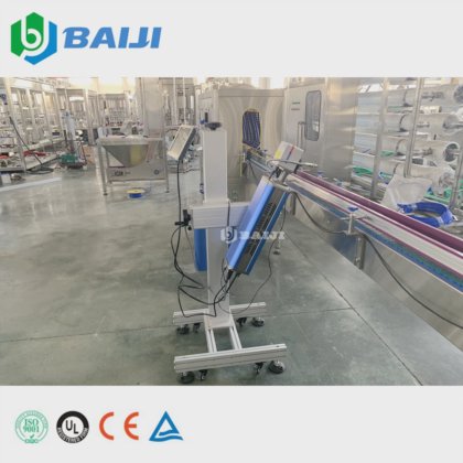Fully automatic laser expiry date code printer for water beverage factory in Suzhou, China